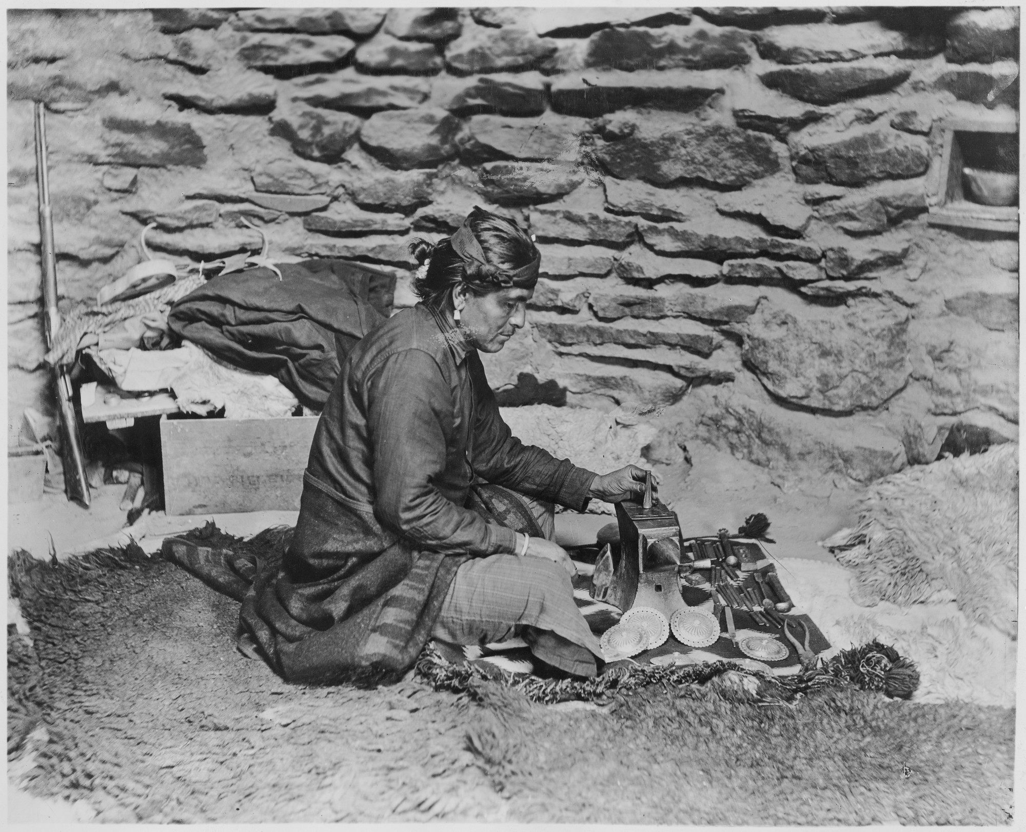"Navaho Silversmith of Arizona. This Navaho is stamping the designs on ...