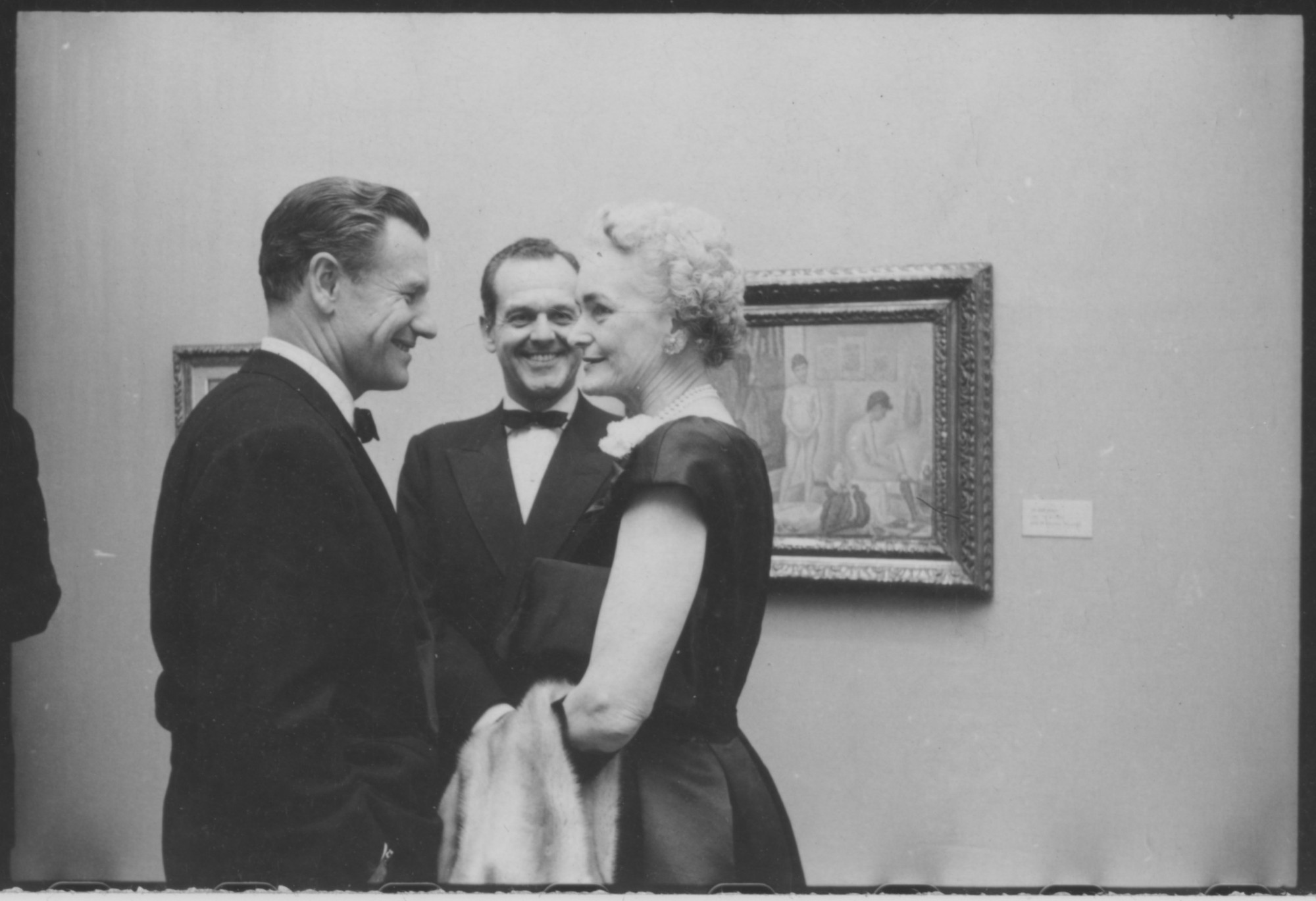 Nelson A. Rockefeller (left) and unidentified guests at the opening of ...