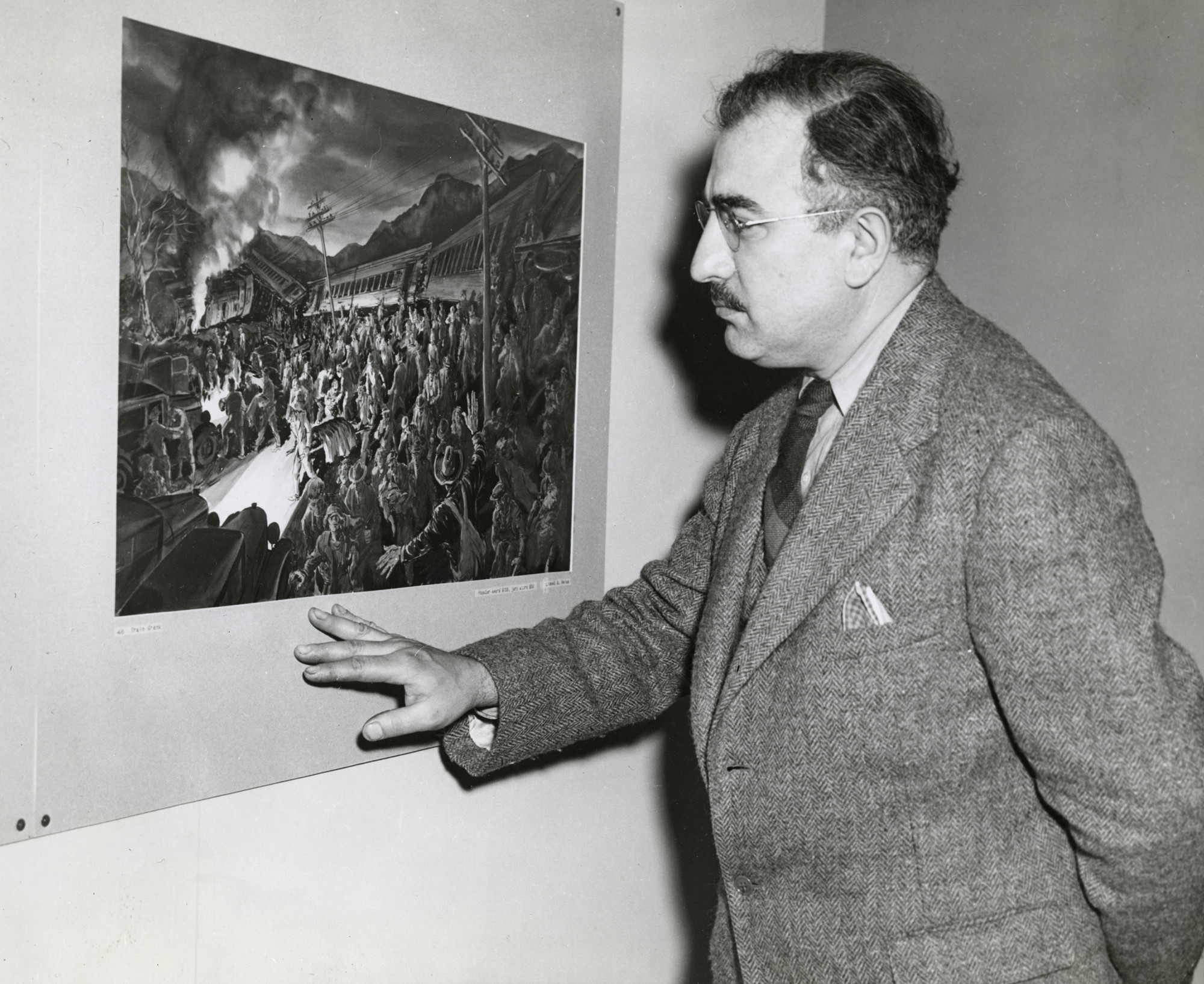 Lionel S. Reiss with his drawing "Train Wreck," at the exhibition, "PM ...