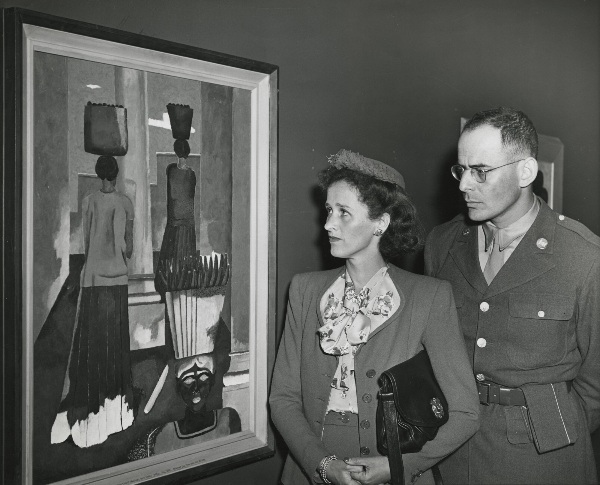 Betsy Cushing Roosevelt Whitney and Lincoln Kirstein looking at a work ...