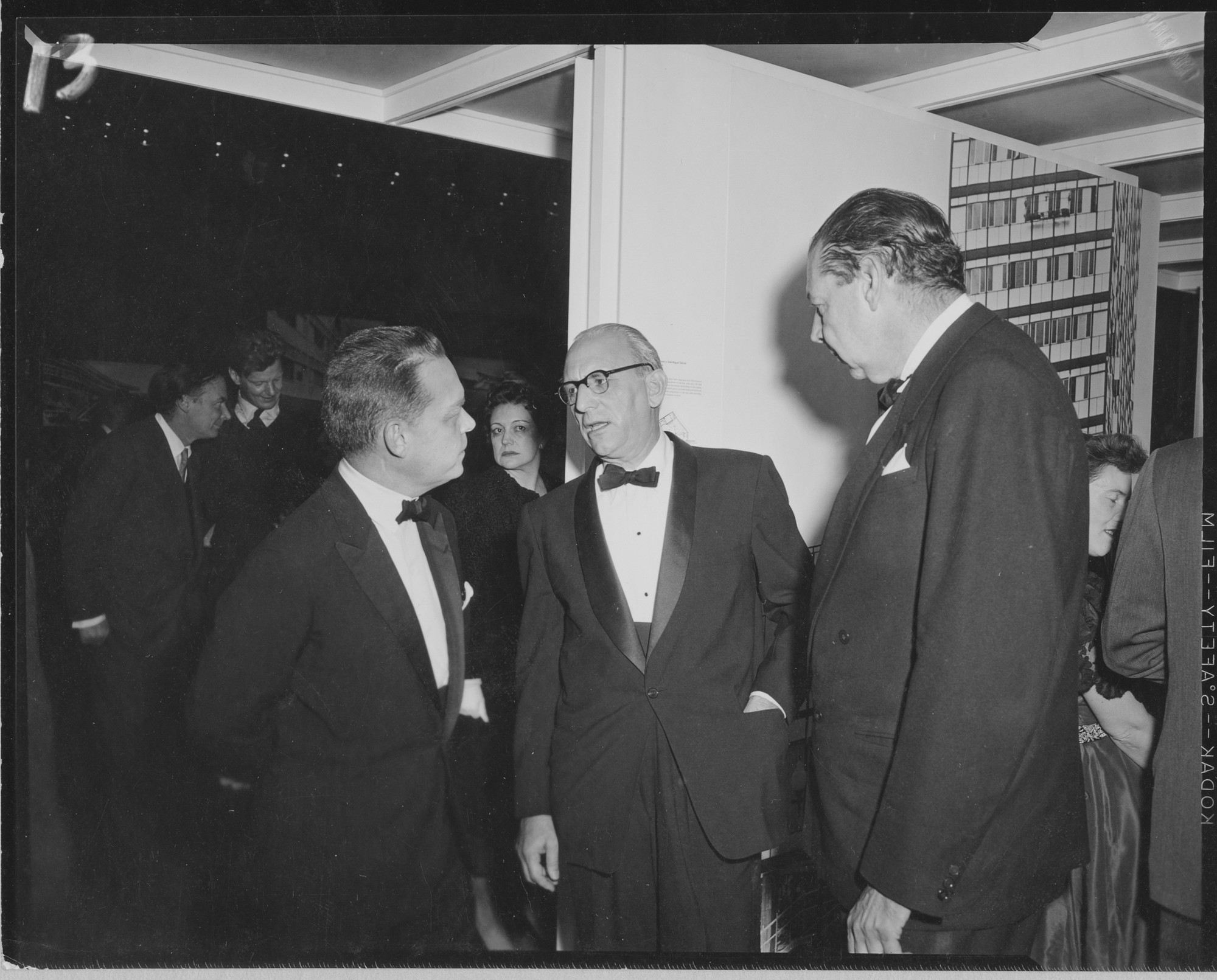 Left to right, Porter McCray, unidentified guest, René d'Harnoncourt at ...