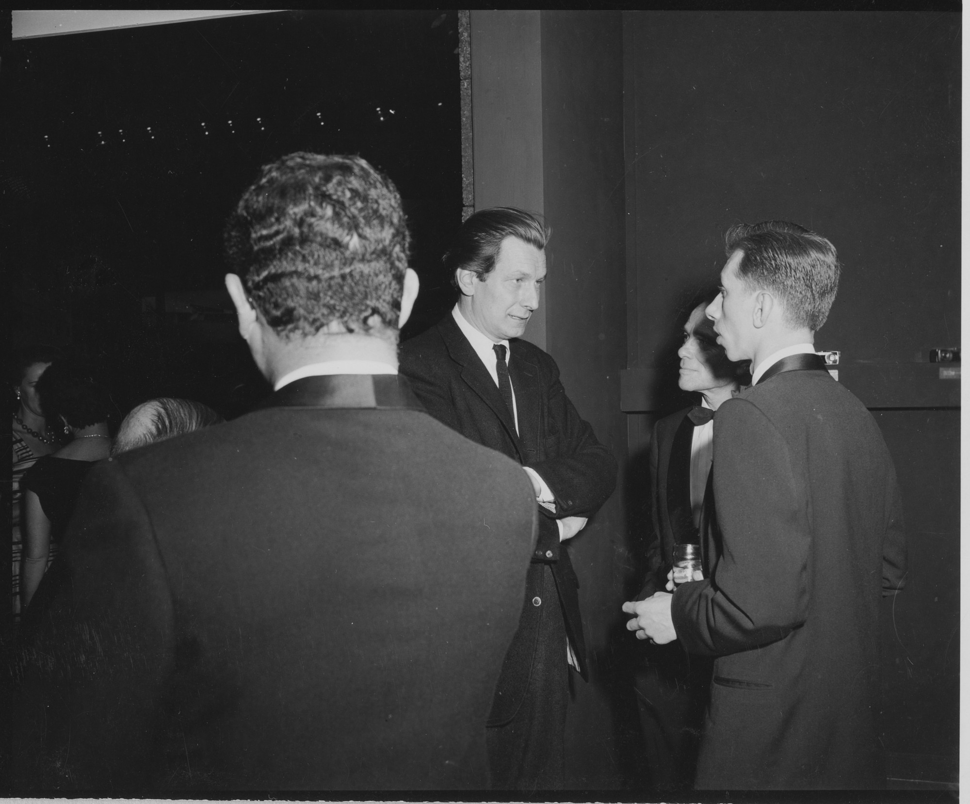 Unidentified guests and (far right) Arthur Drexler at the opening of ...