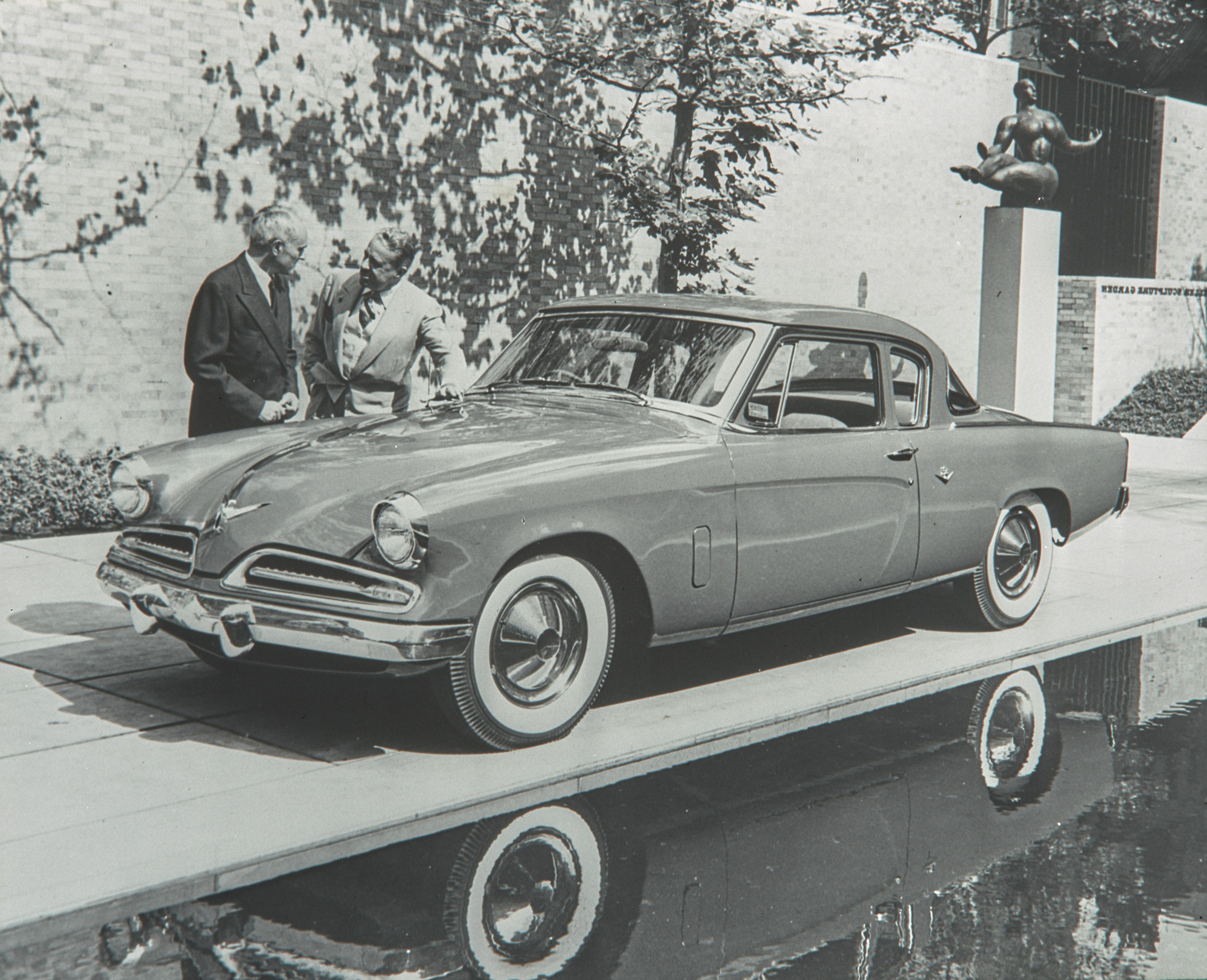 MoMA curator Philip Johnson and designer Raymond Loewy beside a 1953 ...
