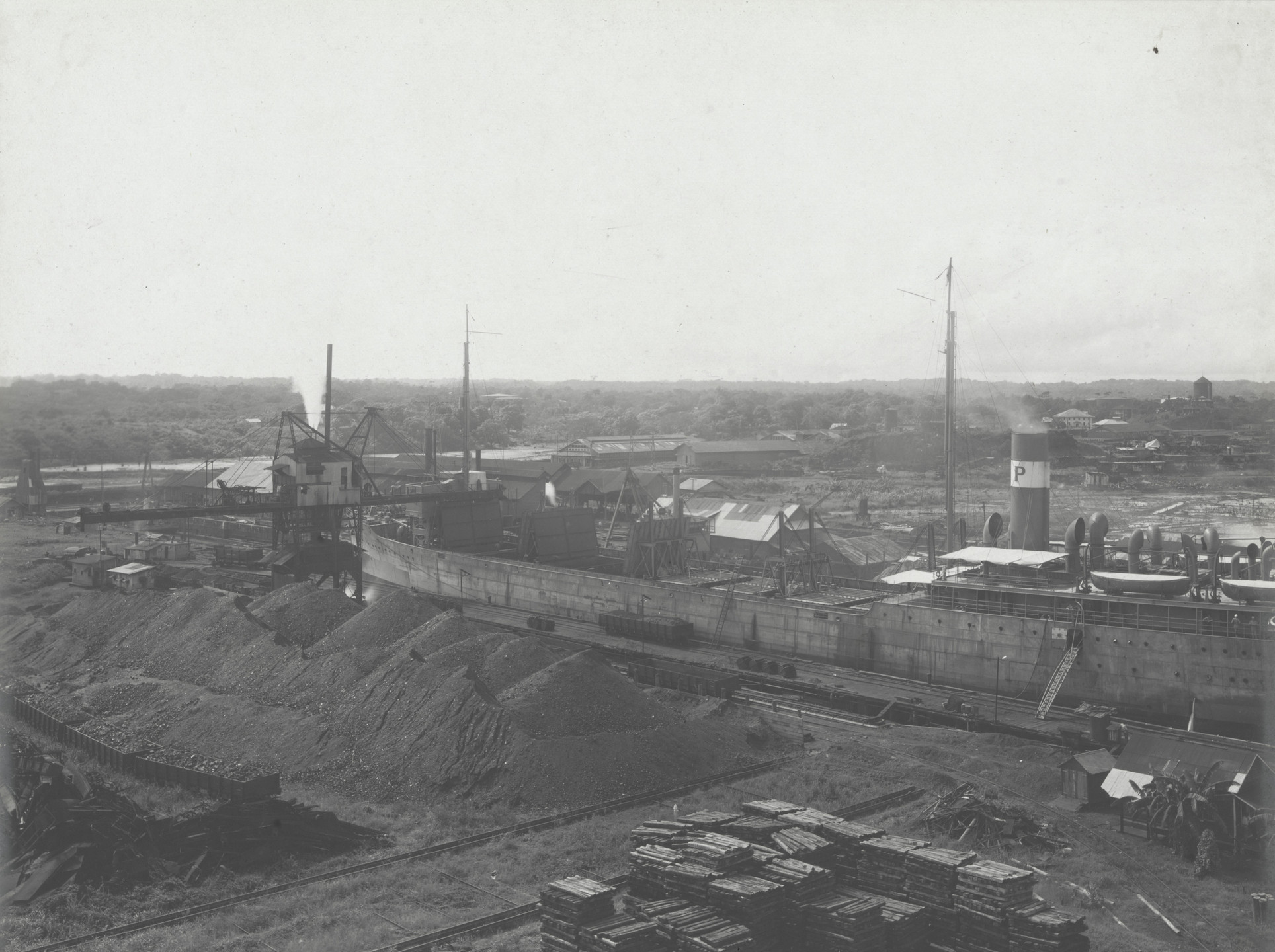 Unidentified photographer. Atlantic Terminals. U.S. Collier unloading ...