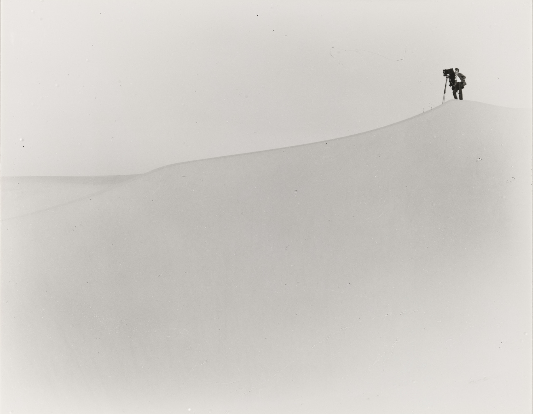 Dody Weston Thompson. Brett Weston On The Dunes, Oceano. 1953 | MoMA