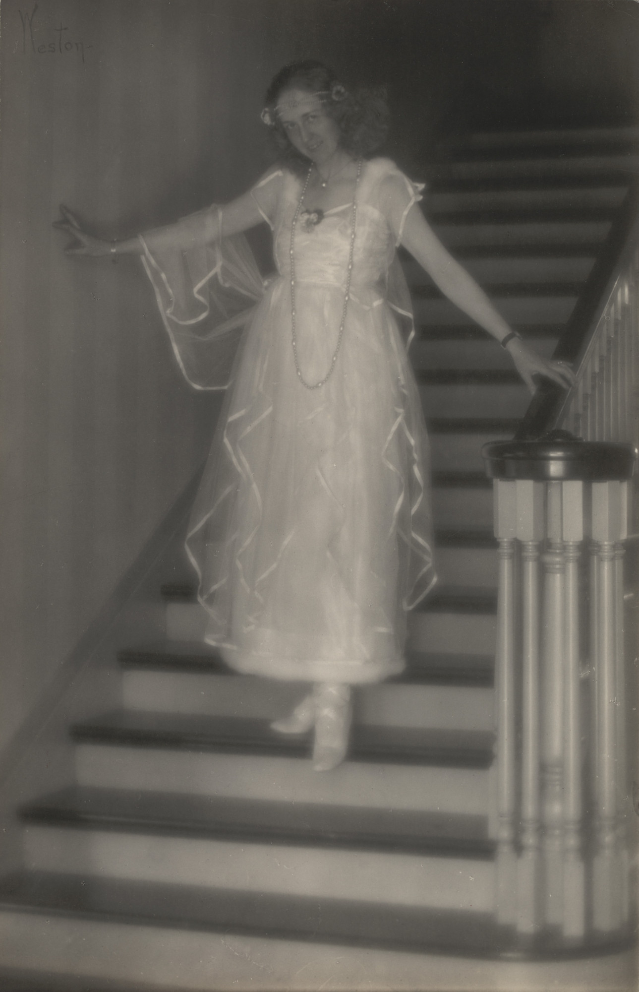 Edward Weston. Violet Romer. (on stairs, hand on banister). c. 1917 | MoMA
