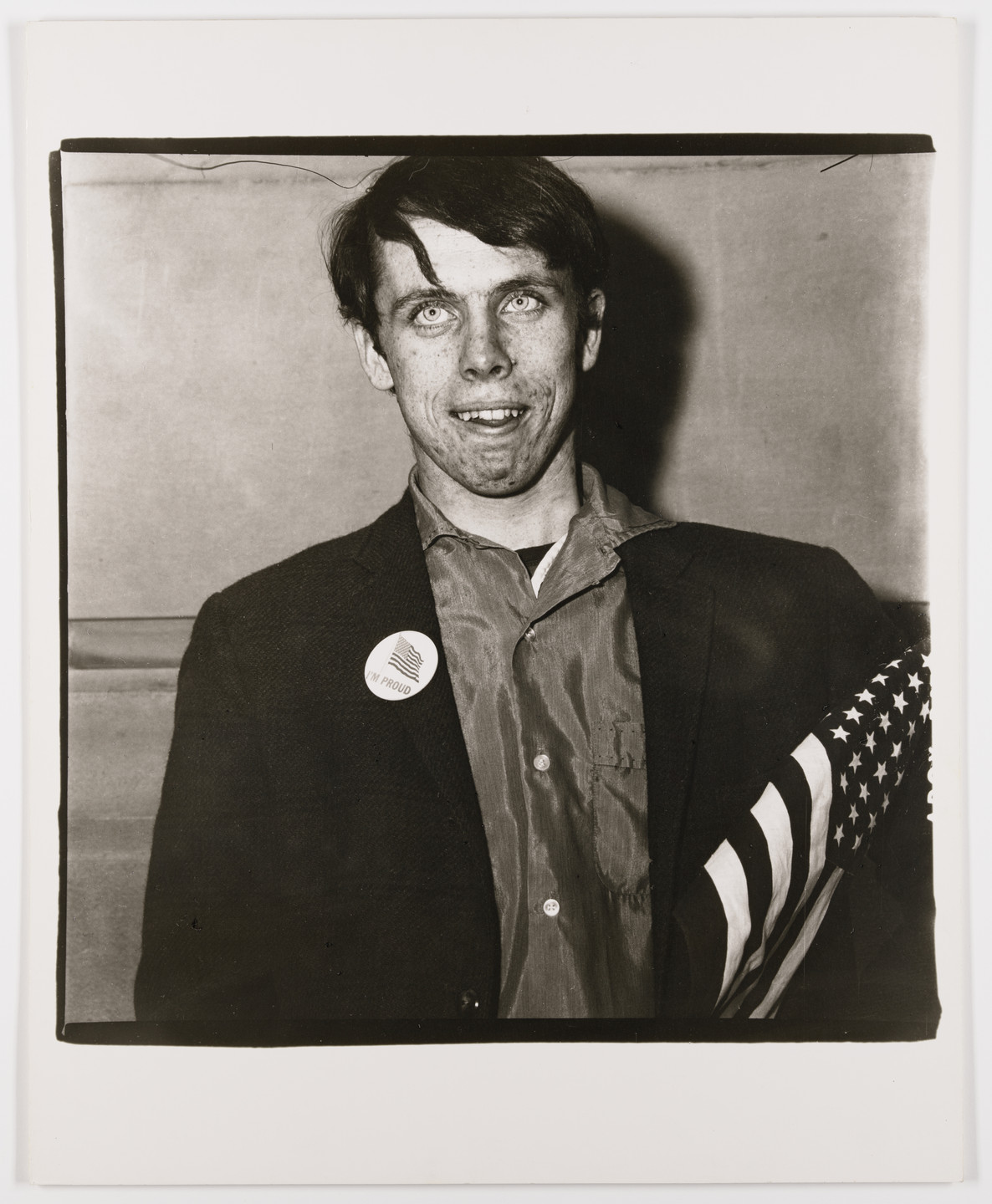 Diane Arbus. Patriotic young man with a flag, N.Y.C., 1967. 1967 | MoMA