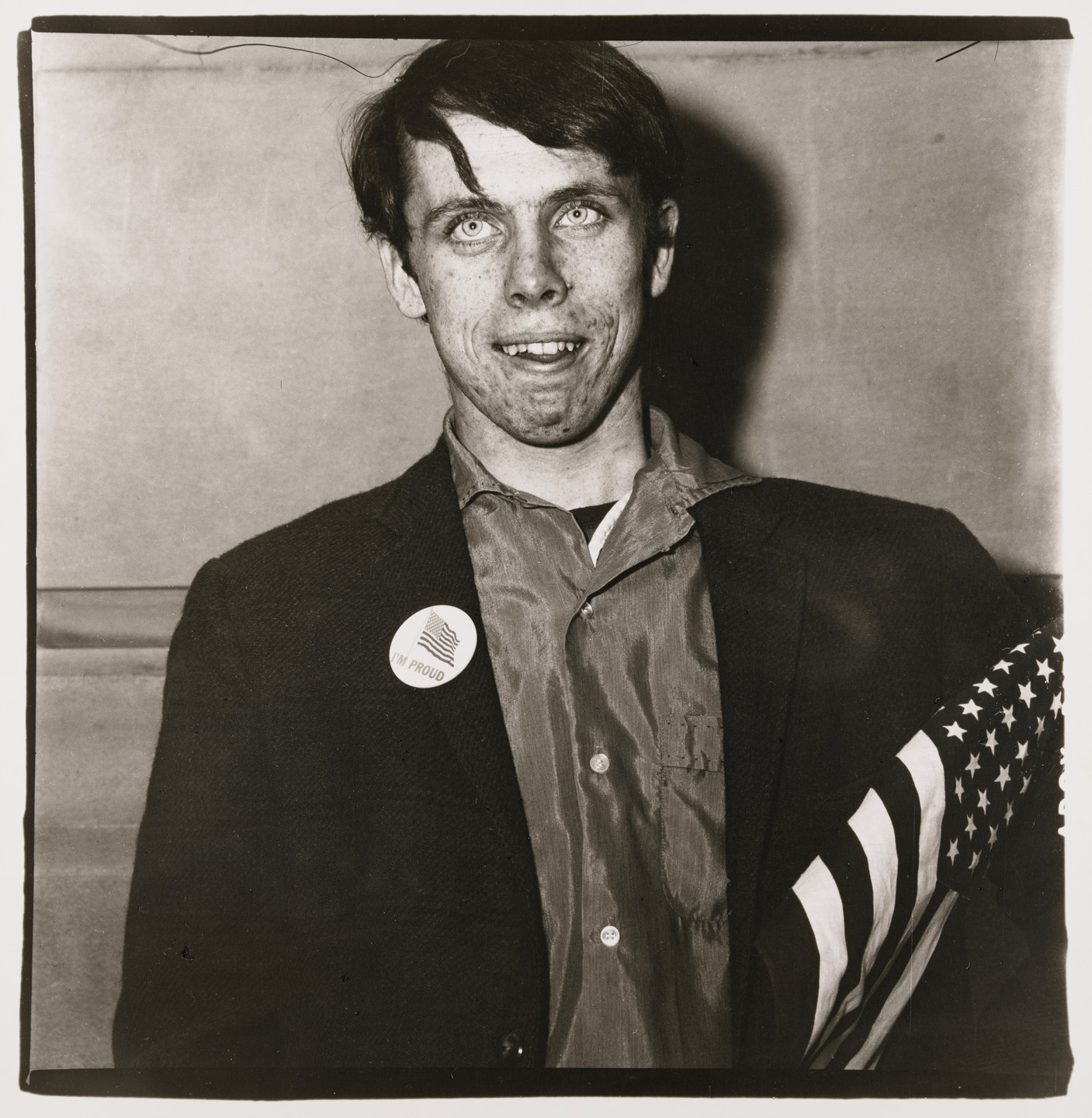 Diane Arbus. Patriotic young man with a flag, N.Y.C., 1967. 1967 | MoMA