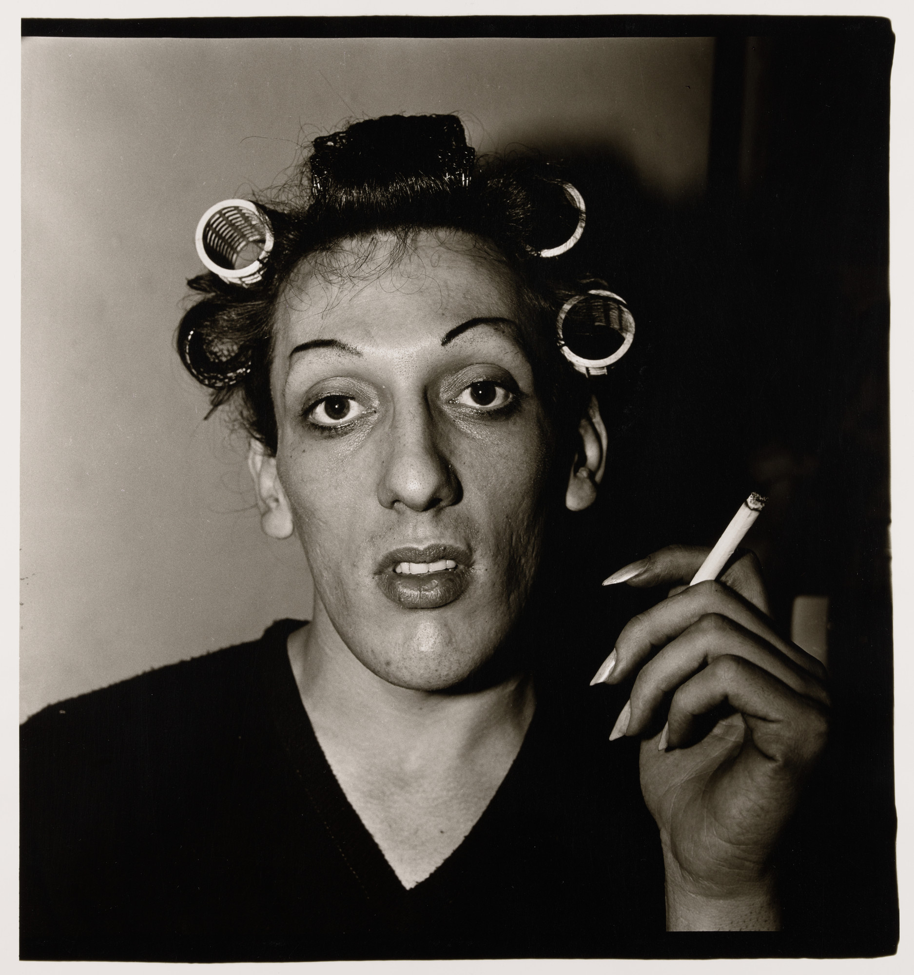 Diane Arbus. A young man in curlers at home on West 20th Street, N.Y.C ...